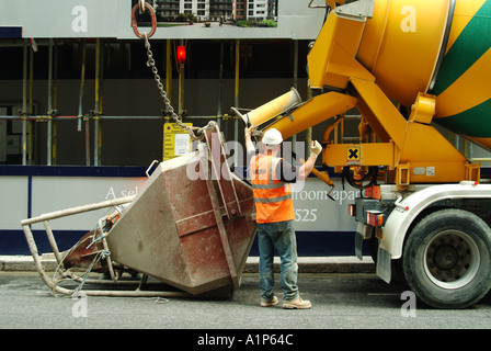 A banksman on a British construction site wearing personal protection ...