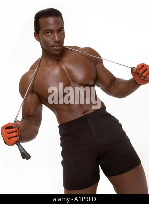 African American male bodybuilder with jump rope draped around neck ...