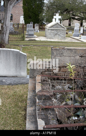 Above ground open crypt in graveyard Stock Photo - Alamy