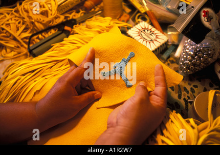 An Apache woman makes a buckskin dress for her niece's Sunrise Dance on ...