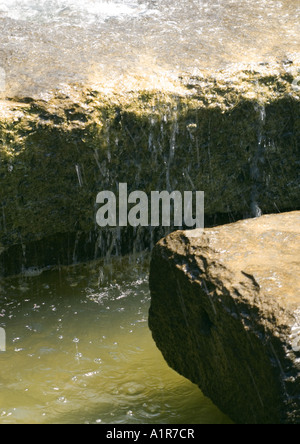 Water splashing over stones blocks, close-up Stock Photo - Alamy