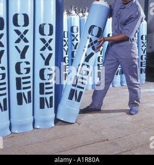 Storage of many various gas cylinders with propane. Red blue and orange ...