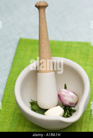 Fresh Single Clove Garlics and mortar, ginger and red chilli on black ...