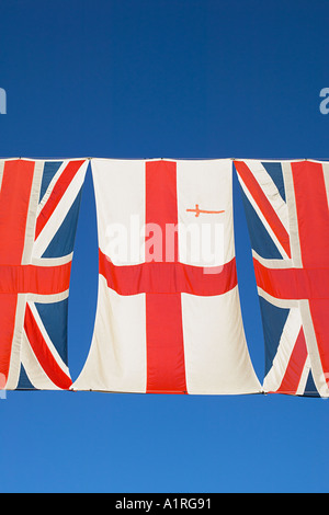 A row of Union Jack and St George cross flags in England, United ...