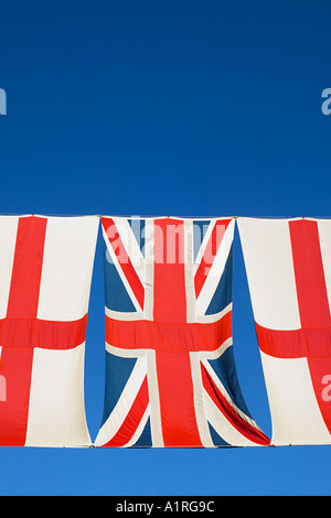 A row of Union Jack and St George cross flags in England, United ...