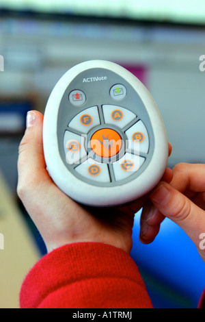 Children using voting pads in a school classroom Stock Photo - Alamy