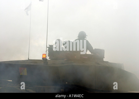Challenger 2 tank making smoke Stock Photo - Alamy