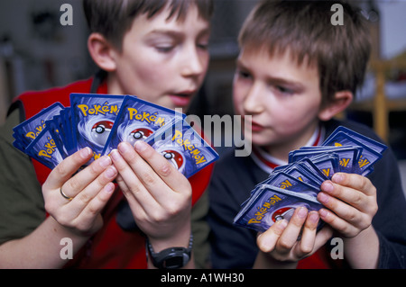 CHILDREN PLAYING WITH POKEMON CARDS LONDON MAY 2000 Stock Photo - Alamy