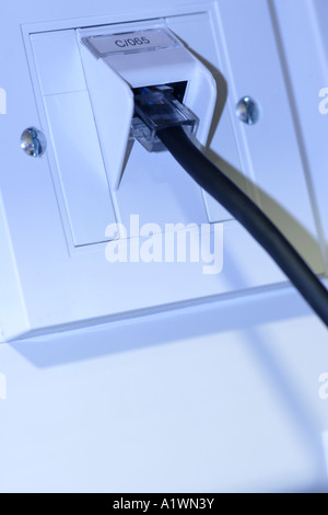 Ethernet cable connected to socket in wall. Internet connection Stock ...