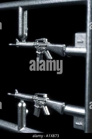 Toy machine gun on airfix kit Stock Photo - Alamy