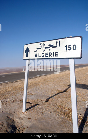 Sign informed about distance to Algeria border on the roadside of ...