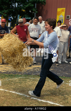 young people throwing bales of hay straw country fair county contest ...