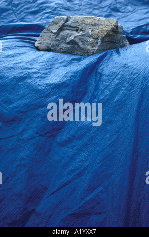 blue vinyl tarp rock Stock Photo - Alamy