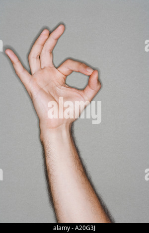 young man making okay sign Stock Photo - Alamy
