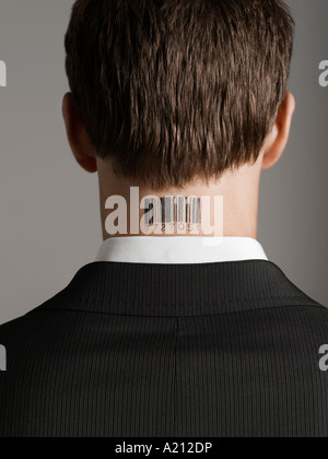 Young man with bar code tattoo on his neck, scratching head, back view ...