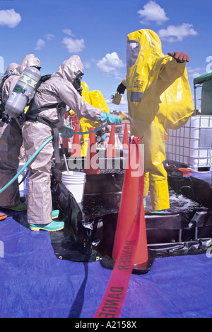 man in hazmat suit getting decontamination wash Stock Photo - Alamy