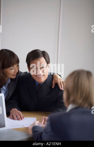 Asian business advisor meeting to discuss and analyze and the situation ...