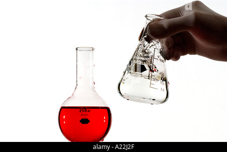 hand with two beakers in lab Stock Photo - Alamy