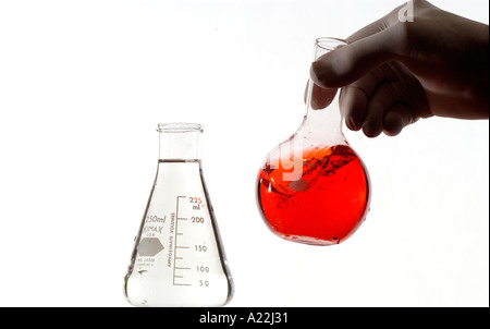 hand with two beakers in lab Stock Photo - Alamy