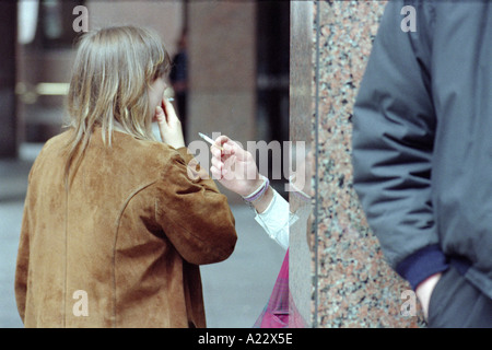 Office workers smoking outside Stock Photo - Alamy