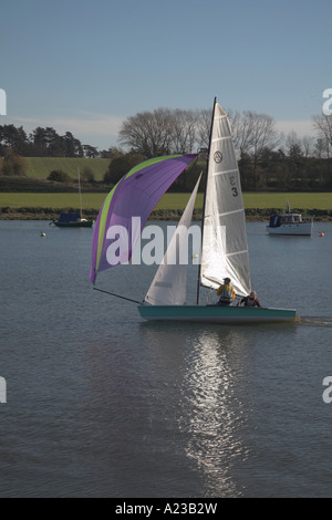 Two person sailing dinghy with jib, main sail and spinnaker River Deben ...