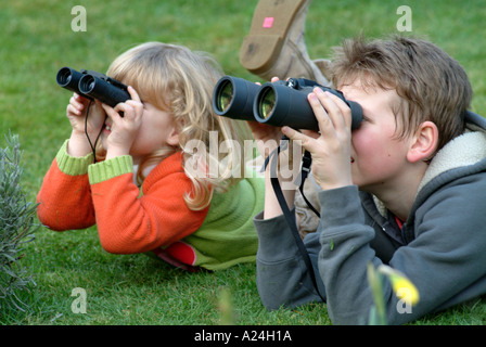 children having fun using binoculars Stock Photo - Alamy