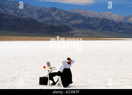 businessman sitting at a table in the computer room Stock Photo - Alamy