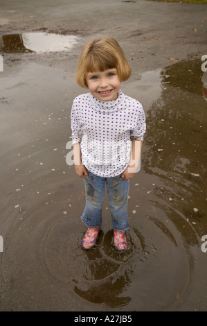 playing in a mud puddle after a rain Stock Photo - Alamy
