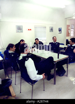 Police Canteen Policemen & Woman Sitting At Table Stock Photo - Alamy