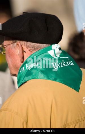 Rear view of Basque man wearing traditional 'blusa' and red neckscarf ...