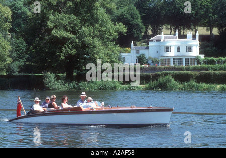 People in a slipper launch on the River Thames at Henley on Thames ...