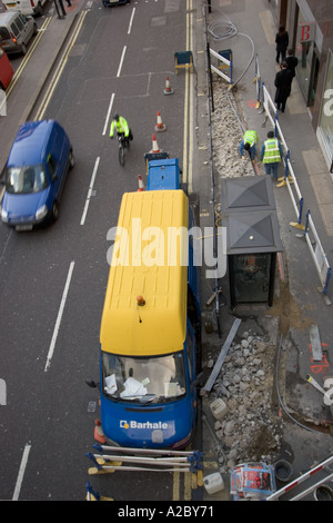 laying cables road works telcommunications BT cables in busy central ...