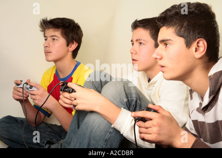 Boys siblings spend time playing interesting games on tablet together ...