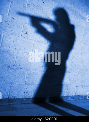 Shadow or silhouette of man pointing and aiming a shotgun Stock Photo ...