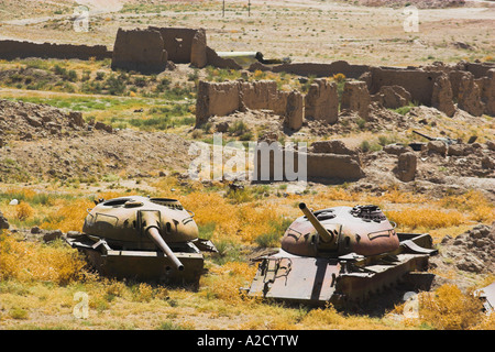 AFGHANISTAN Ghazni Military graveyard with ancient city walls and ...