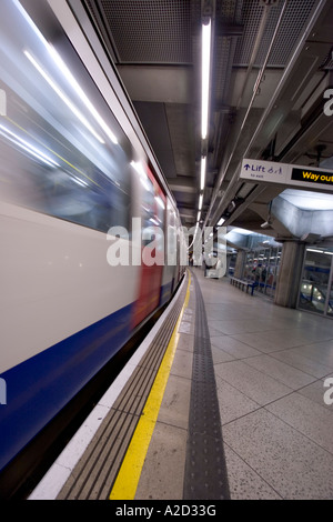 London Underground tube network with speeding train entering station ...