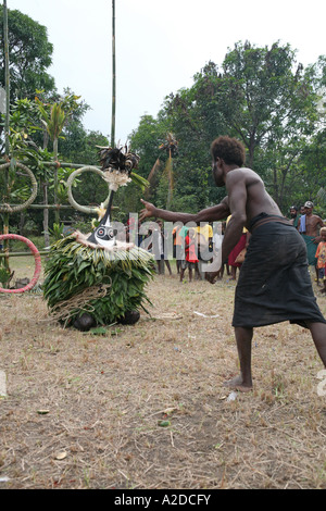 Men throw shell money at Tubuans at a Tolai Death Ceremony, Matupit ...