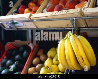 Peaches, plums, bananas on display at outside fruit and veg stall ...