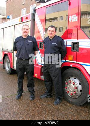 firemen standing next to West Sussex Fire and Rescue Service vehicle in ...