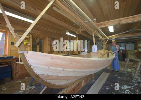 A traditional lapstrake rowboat being built with traditional ...