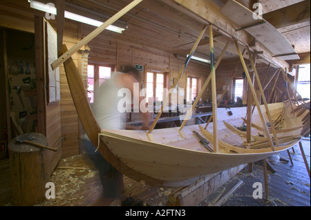 A traditional lapstrake rowboat being built with traditional ...