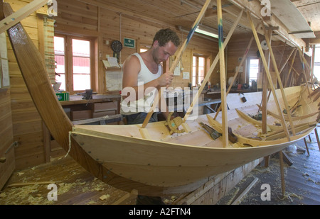 A traditional lapstrake rowboat being built with traditional ...