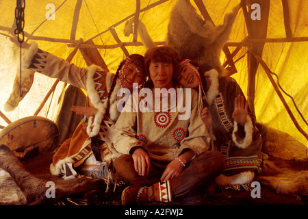 ASIA, Russia, Kamchatka Native woman posing in traditional dress by the ...