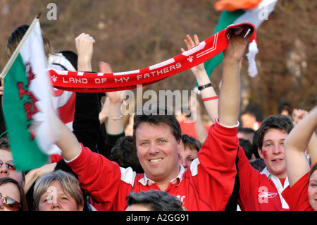 Welsh rugby supporters in scarves and shirts drinking in a bar before ...
