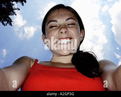 Portrait of a girl looking down onto a camera lens Stock Photo - Alamy