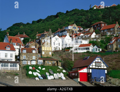 Clinging to the hillside a cottage at Runswick Bay. The village has ...