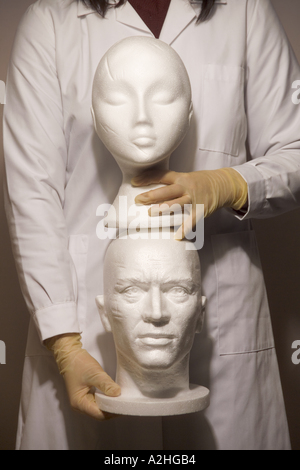 two female dummy doctor heads wearing textile surgical cap and medical ...