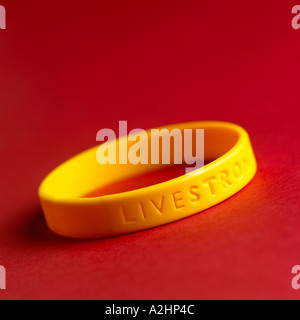 Square format image of Red Livestrong band on a red background Stock ...