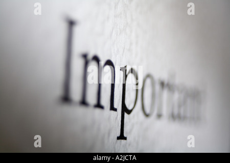 the word important printed on to texture paper Stock Photo - Alamy