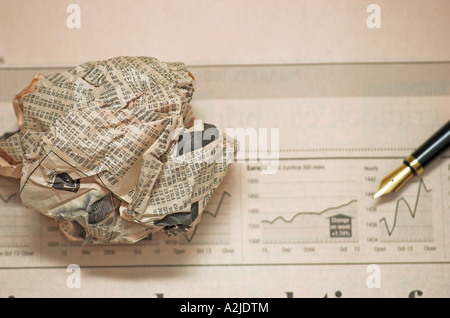 Scrunched ball of newspaper on flat page of newspaper Stock Photo - Alamy